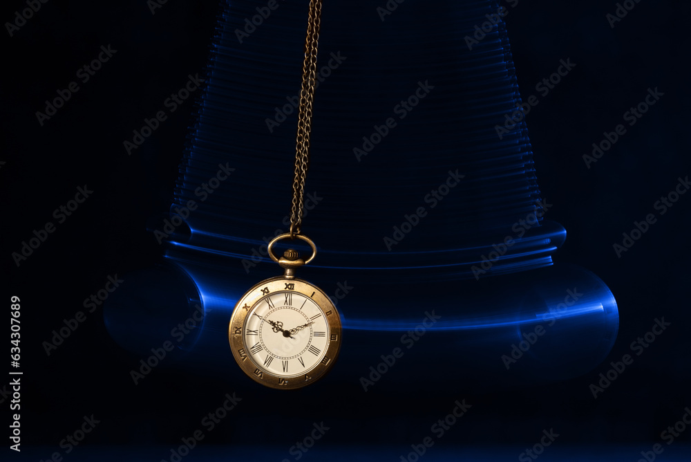 Hypnosis session. Vintage pocket watch with chain swinging over surface ...