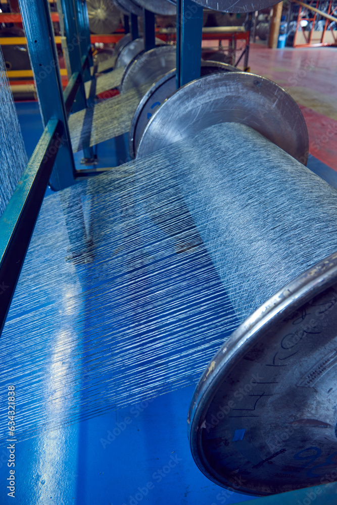 Cotton threads in industrial cotton in a weaving factory, machine ...