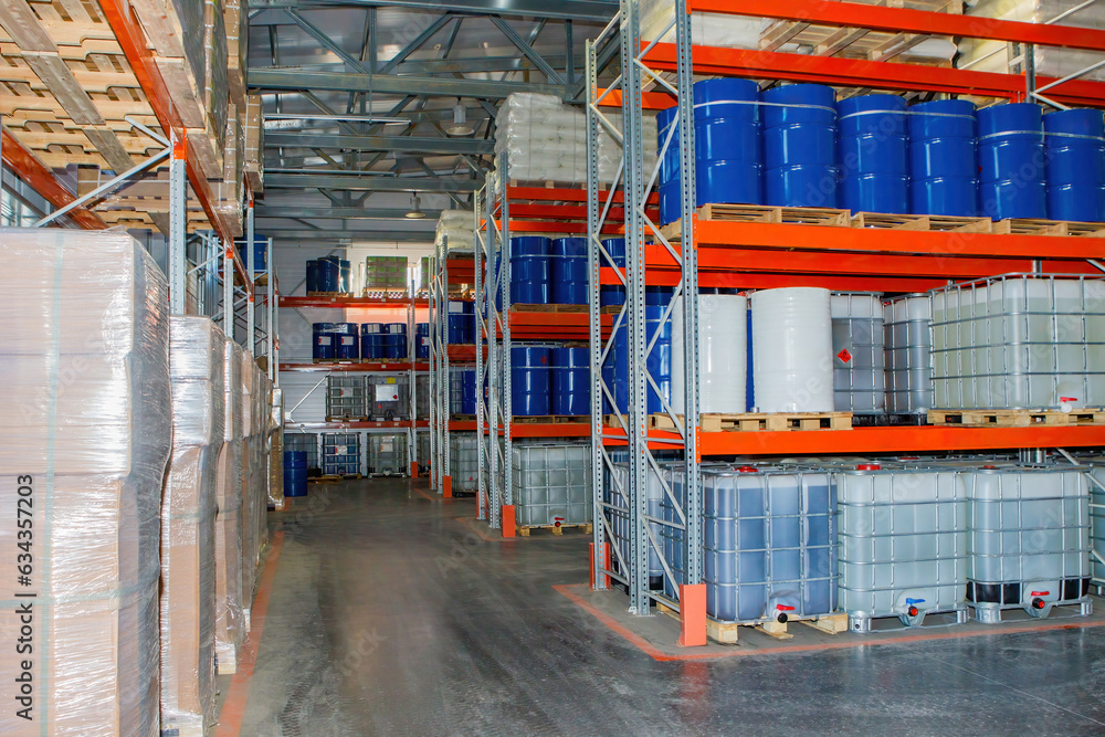 Warehouse interior. Storage company. Barrels for liquids inside ...