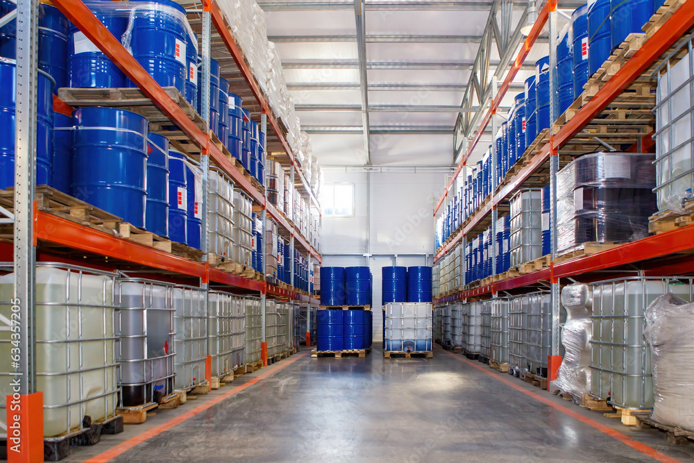 Logistic warehouse. Barrels for chemical storage. Plastic and metal ...