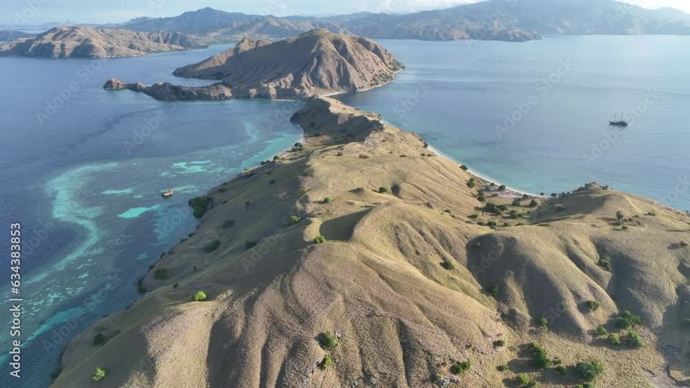Beautiful coral reefs fringe the scenic island of Gili Lau Laut in ...