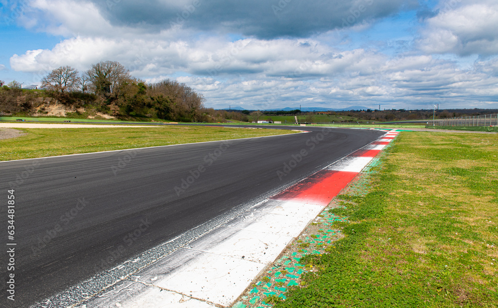 Motor sport asphalt race track and curbs with skid marks, low angle ...
