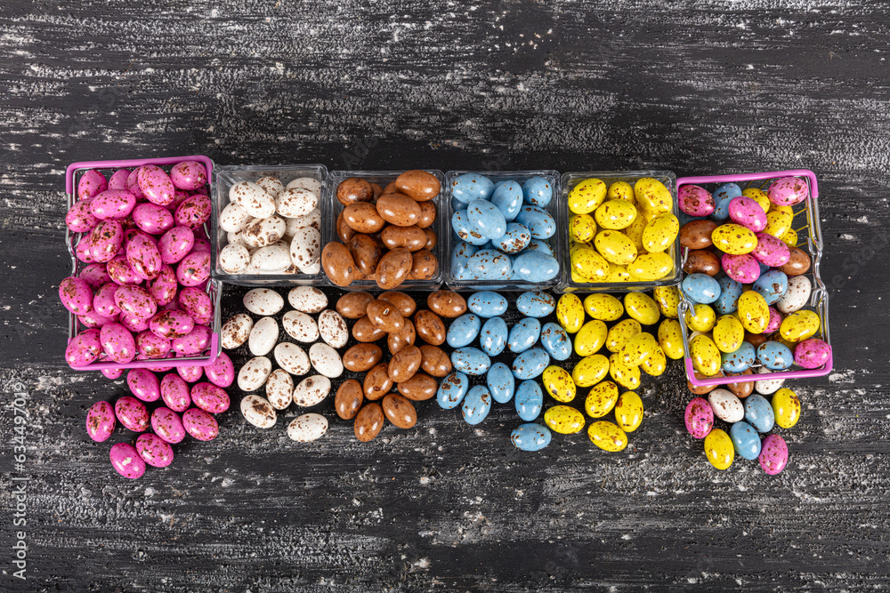 Heap of sugared almonds and hazelnuts dragees in chocolate isolated on ...