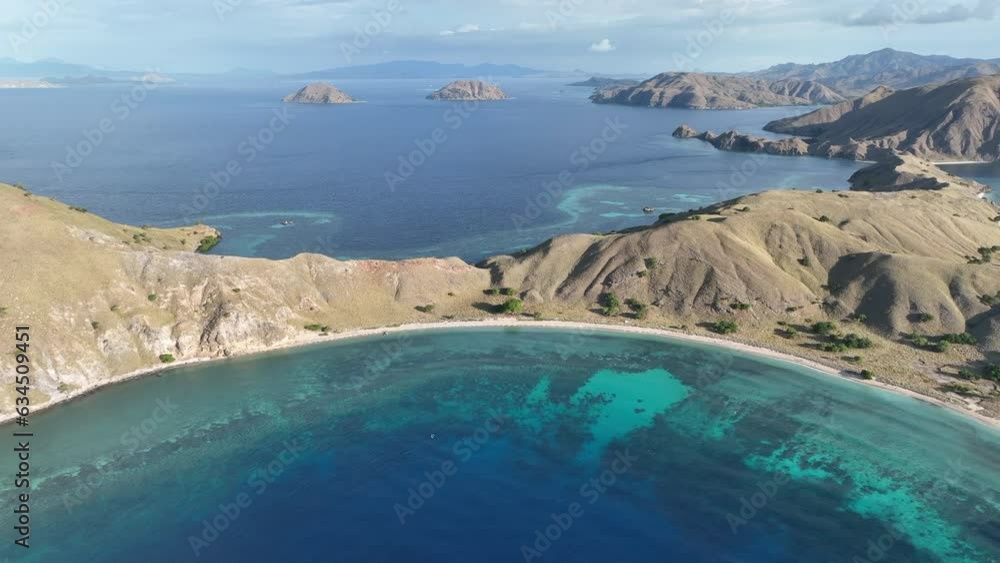 Beautiful coral reefs fringe the scenic island of Gili Lau Laut in ...