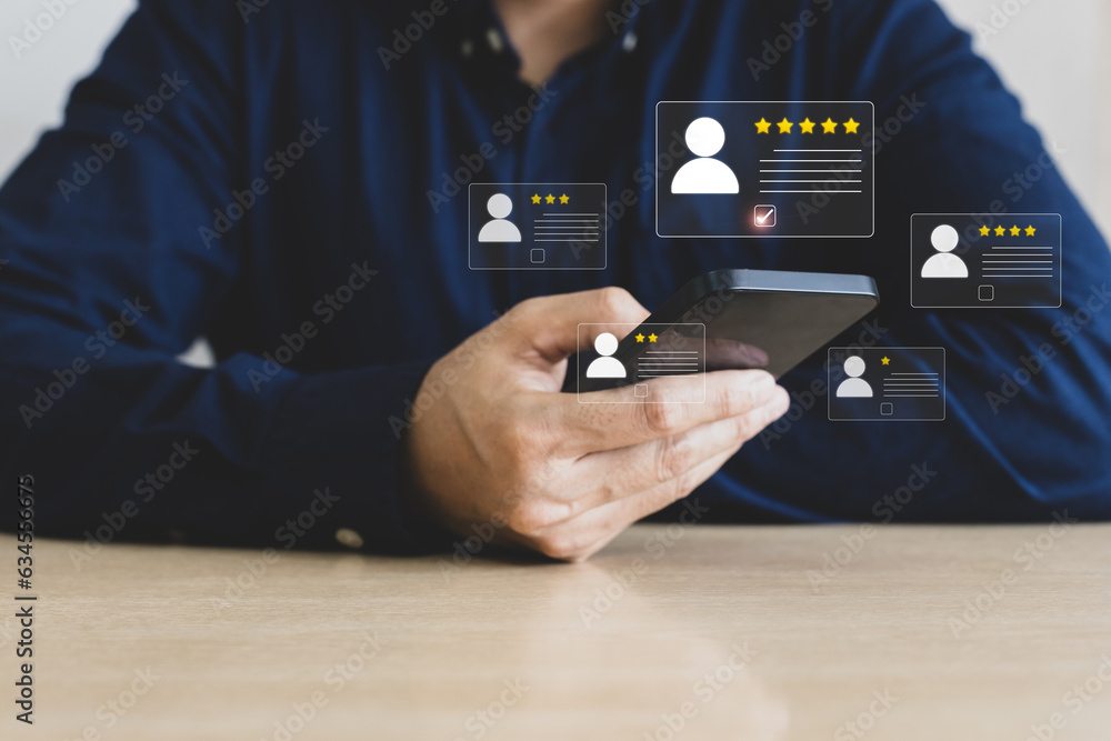 Customer holding smartphone giving a five star rating with rating ...