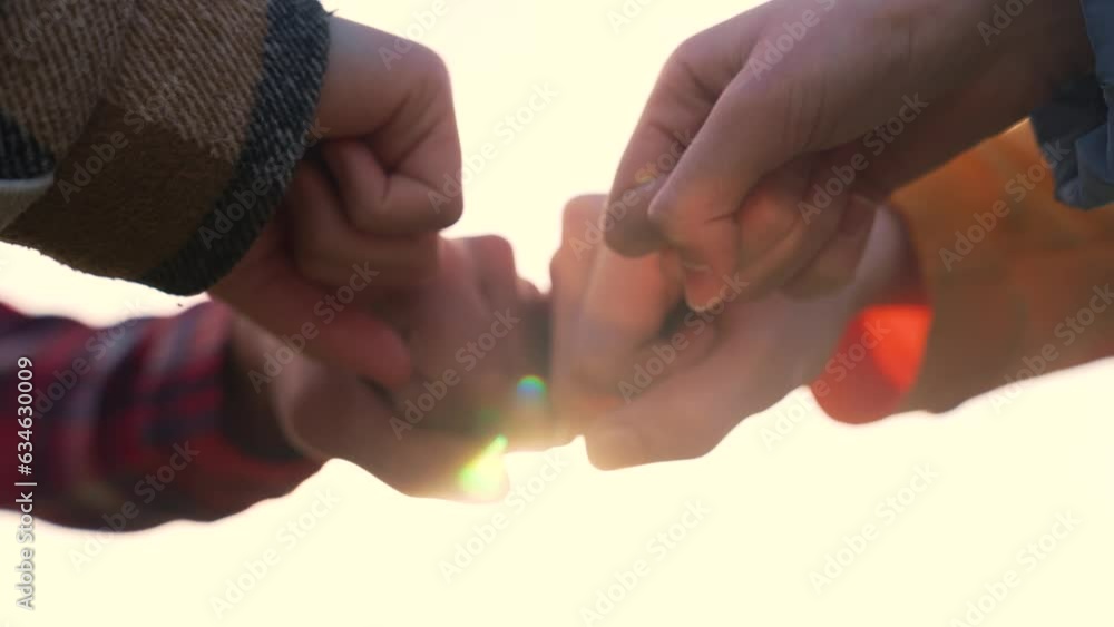 Teamwork.Group of people partners hitting their fists together ...