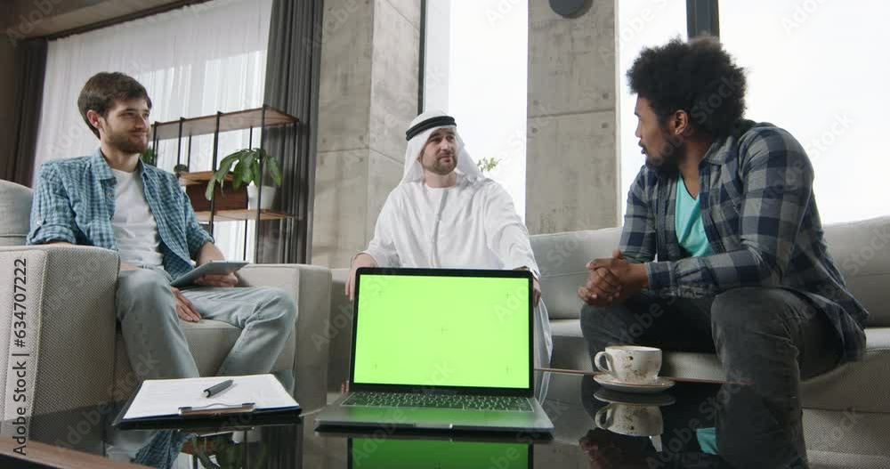 Laptop with green screen between students. Template for inserting your ...