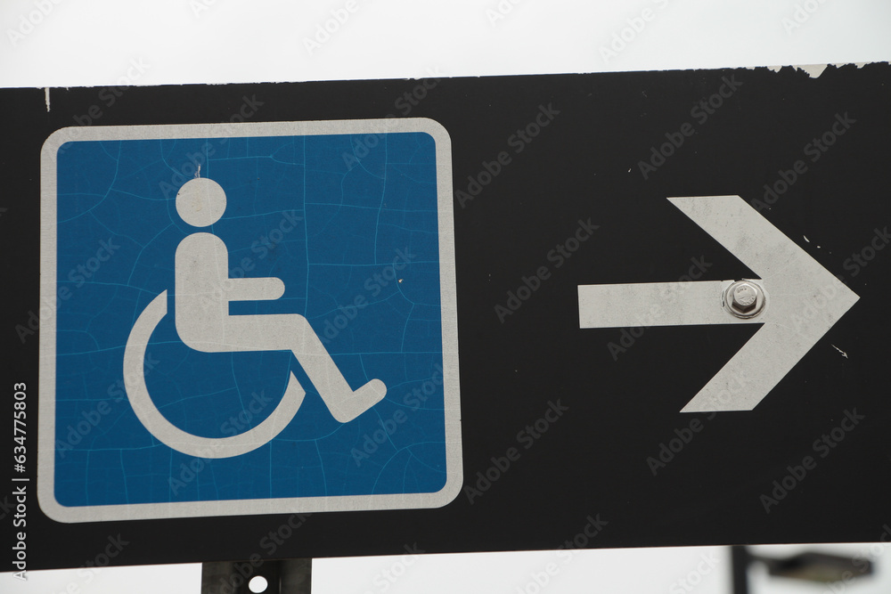 handicap sign blue logo with white arrow on its right pointing right on ...