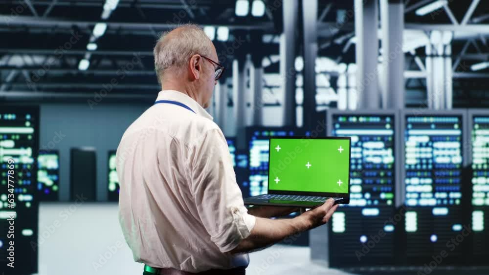 Knowledgeable IT professional navigating network of server racks in ...