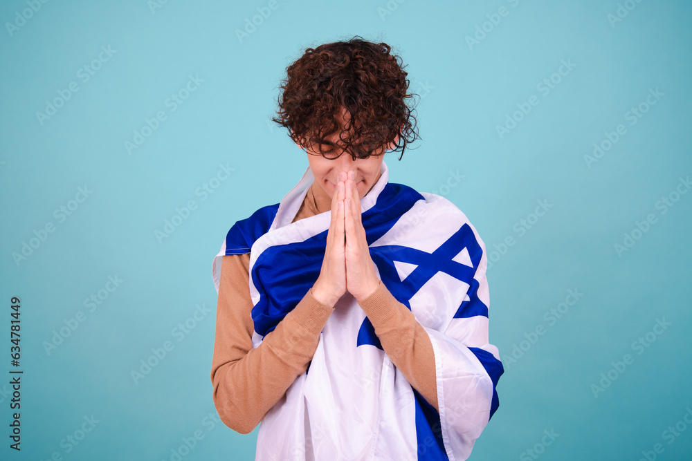 Funny curly student with the Israeli flag. Attractive guy posing on a ...