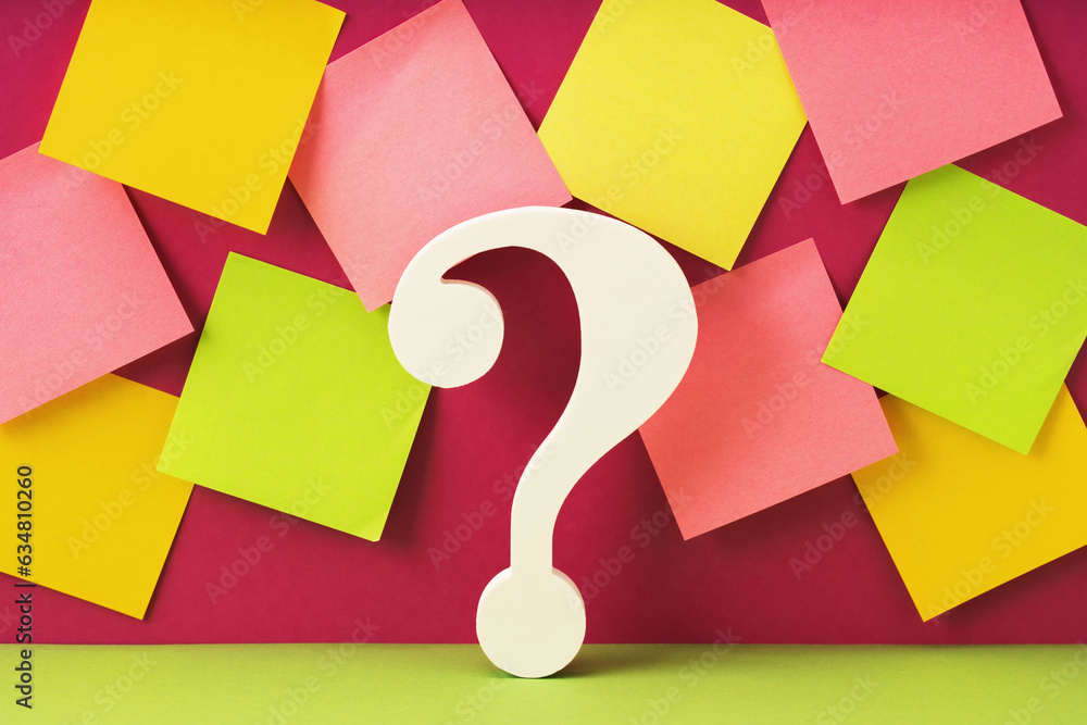 White question mark symbol against many mockup notes background. QandA ...