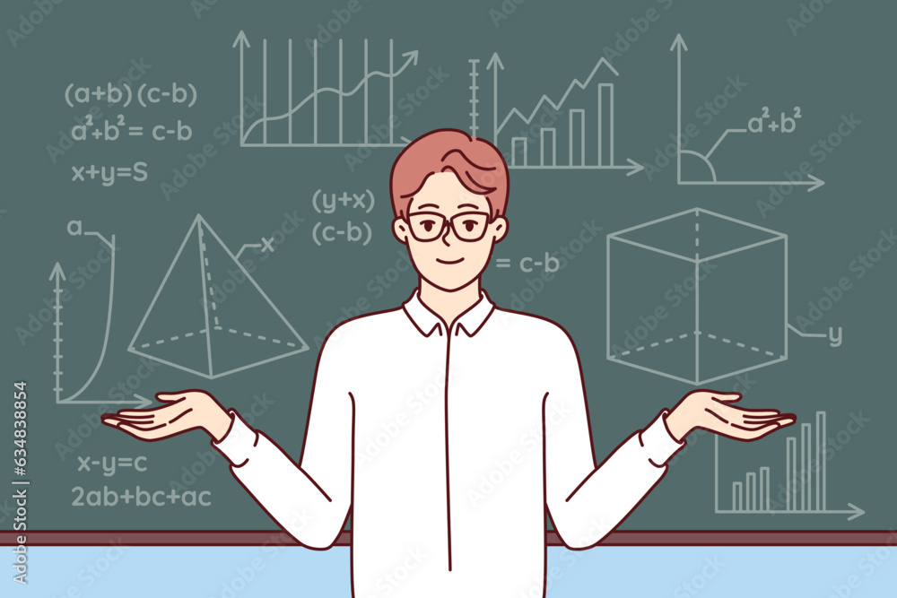 Man mathematics teacher stands near school blackboard with formulas and ...
