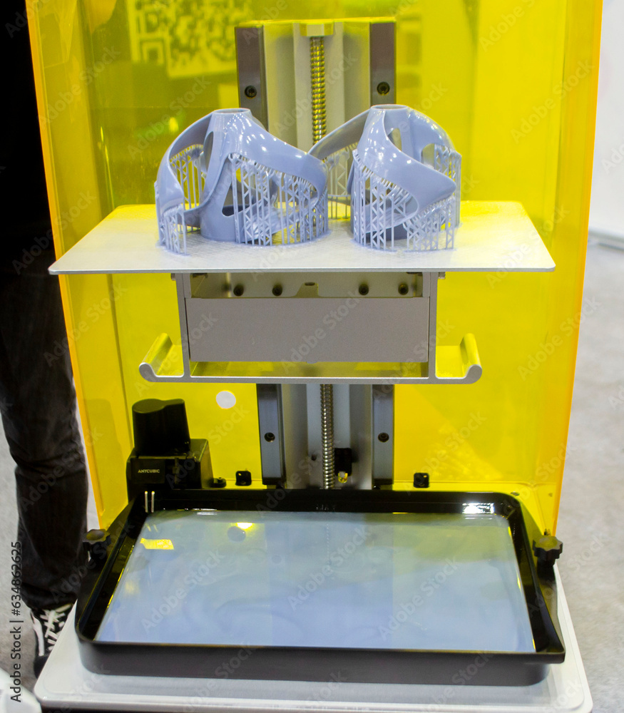 Printed models on 3D printer close-up. Objects printed on photopolymer ...