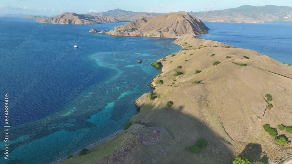 Beautiful coral reefs fringe the scenic island of Gili Lau Laut in ...