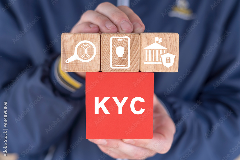 Man holding colorful blocks with icons and abbreviation: KYC. Concept ... Man holding colorful blocks with icons and abbreviation: KYC. Concept ...