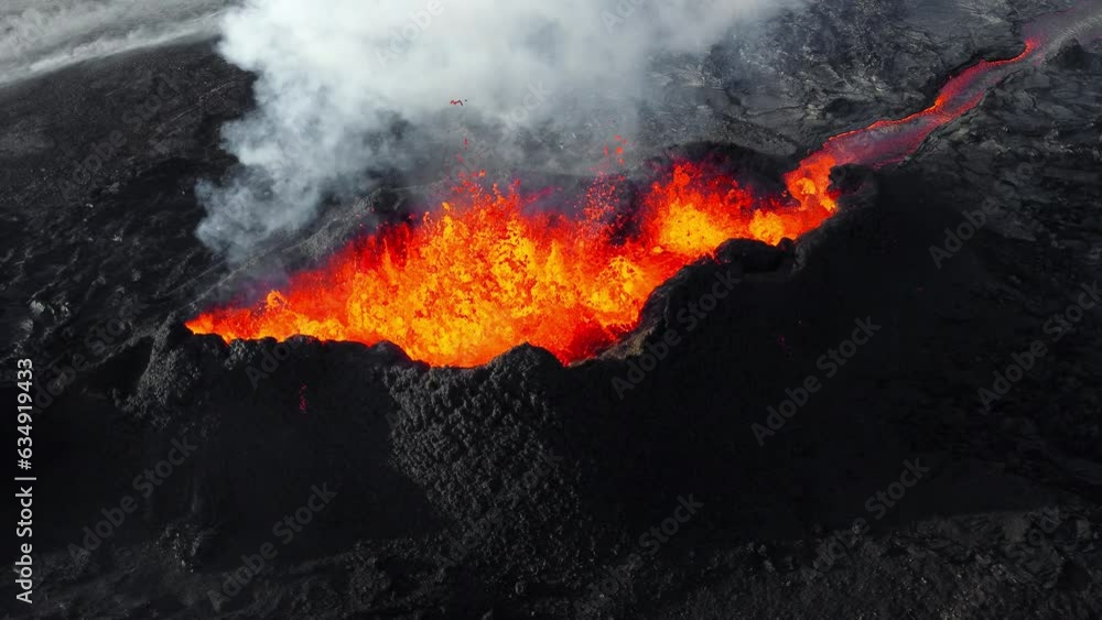 Volcano eruption, red hot burning lava erupts from ground, drone fly ...