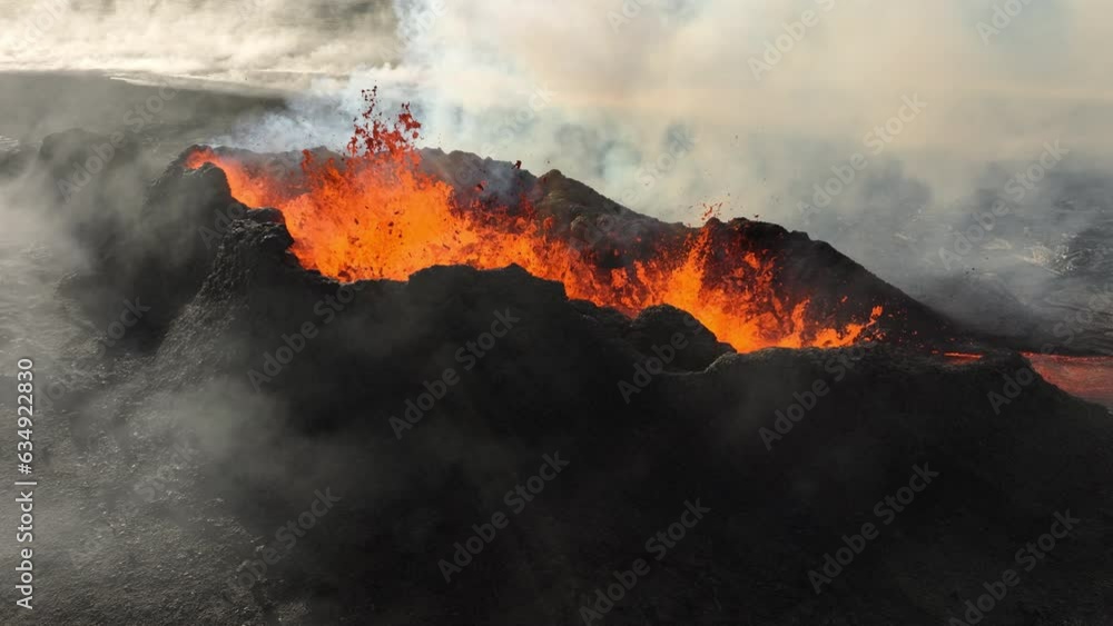 Volcano eruption, red hot burning lava erupts from ground, drone fly ...
