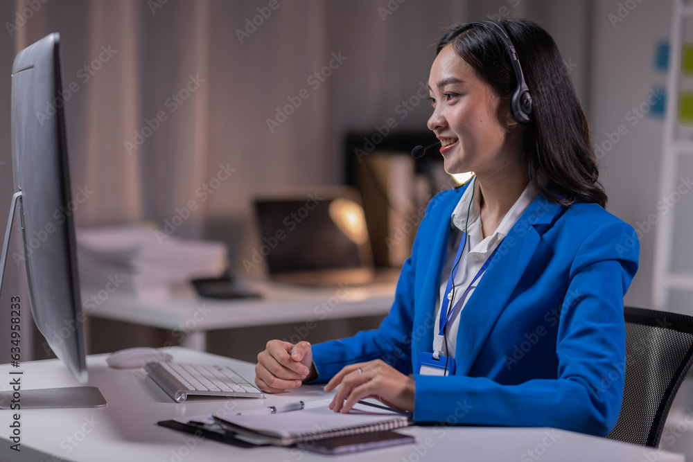 Call center agent with headset working on support hotline in modern office with copy space ...