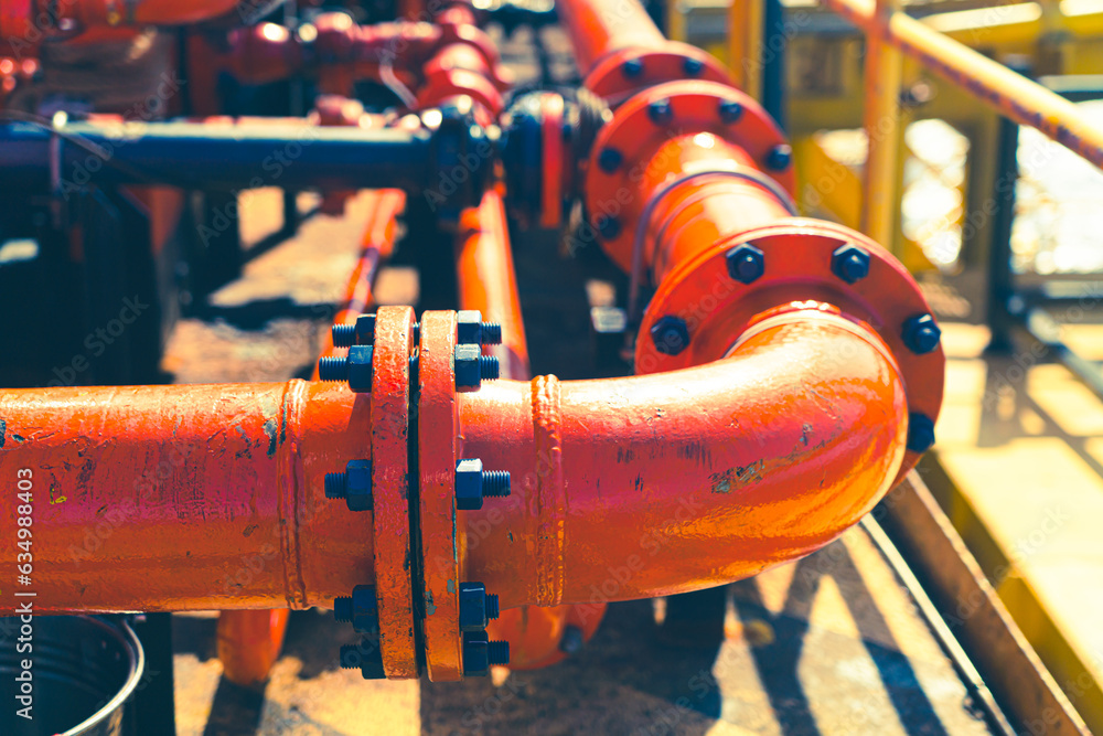 .Close-up of used flanges and welded pipes starting to rust with heavy ...