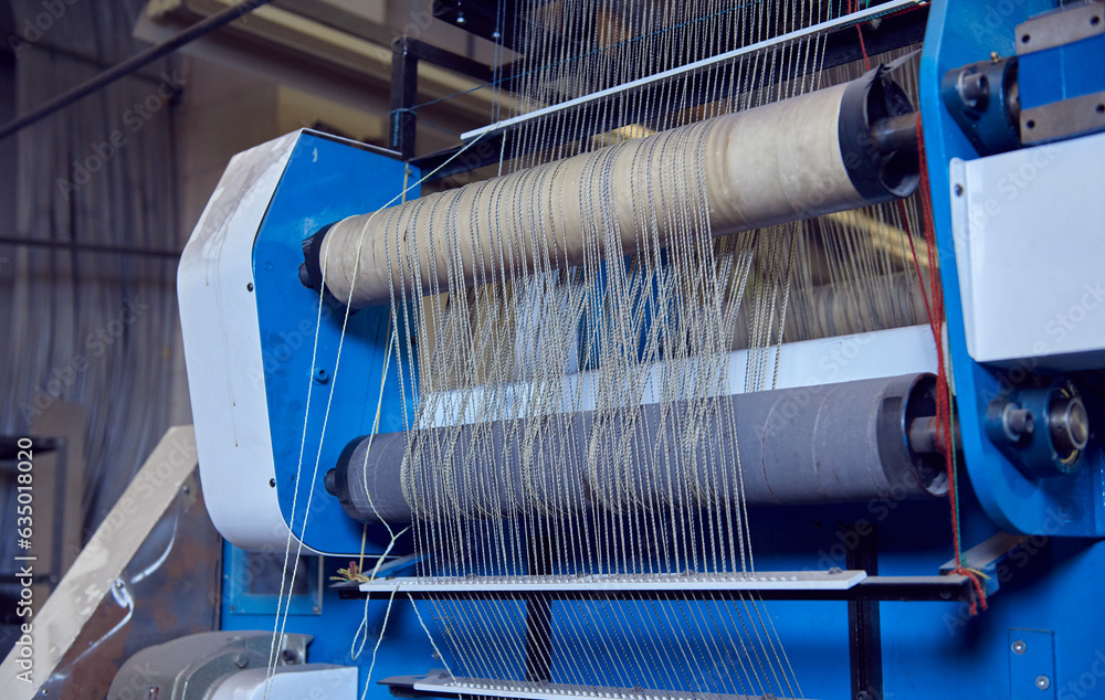 Cotton threads in industrial cotton in a weaving factory, machine ...