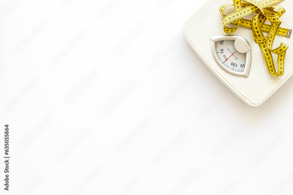 Floor weight scales and tape measure for body weight control, top view ...