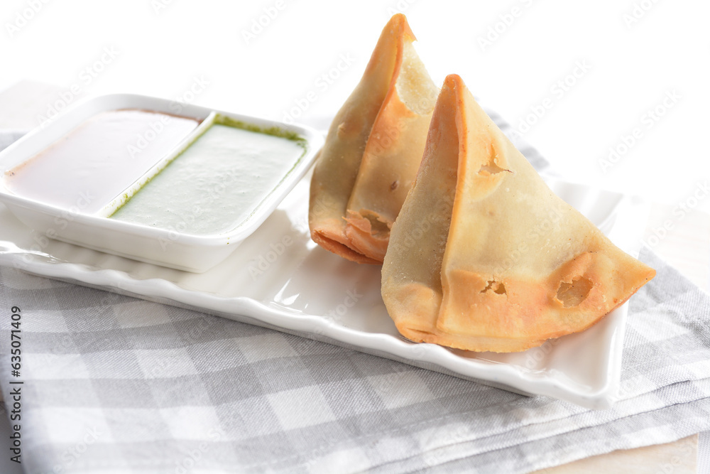 deep fried indian curry potato vegetable samosa snack with green mint ...