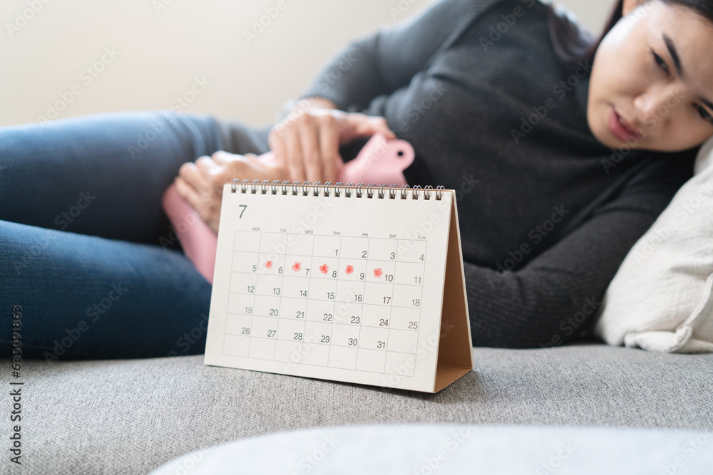 Monthly menstruation symptom period concept. Close up calendar marking ...
