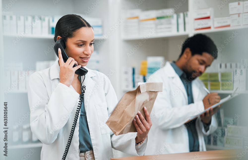 Pharmacist, telephone and medicine package for customer service ...