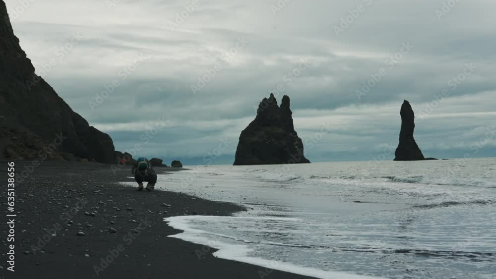 Reynisdrangar basalt sea stacks on Reynisfjara black sand beach near ...