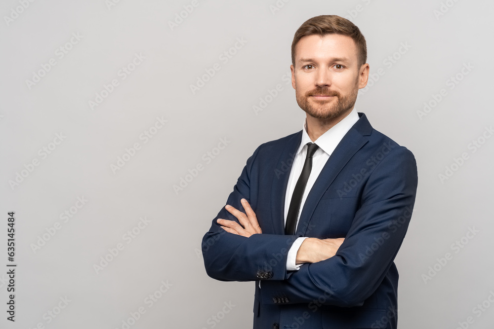 Successful trader man in business suit on studio gray background ...