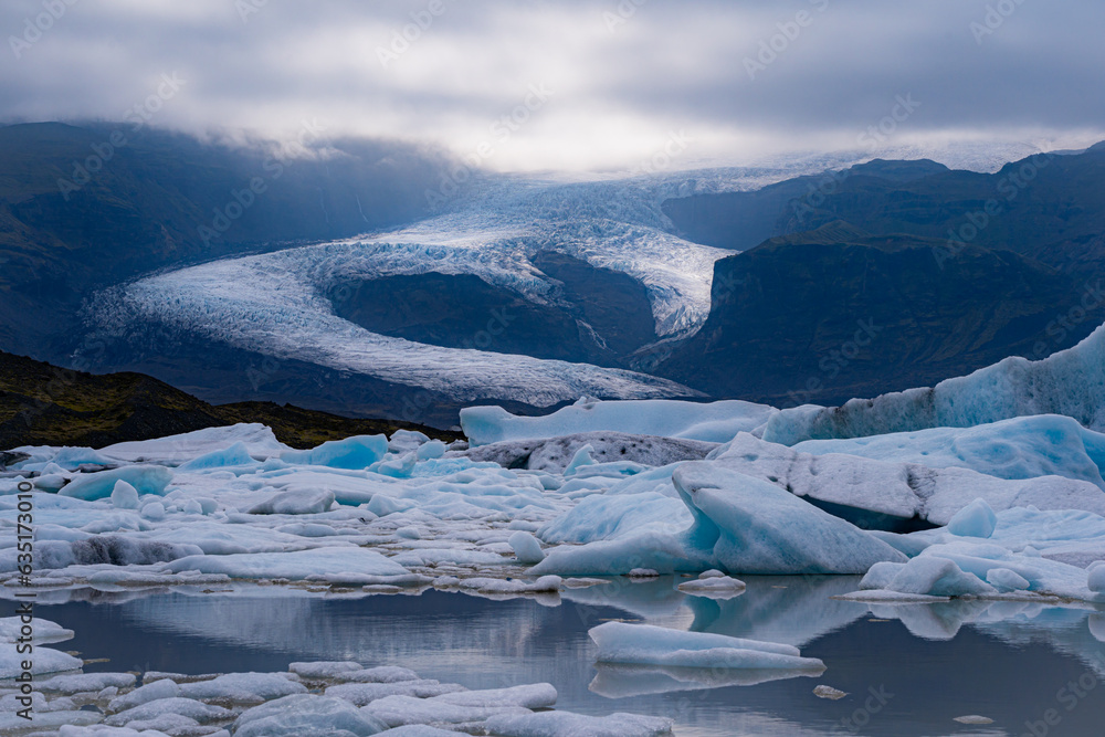 Big glacier with layers of ice hundreds of years old deposited together ...