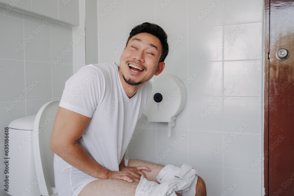 Funny happy face of asian man able to poop after suffer from ...