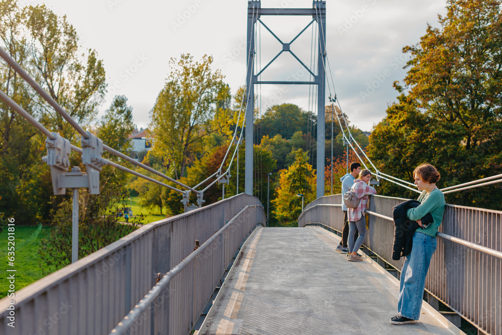 Sad teenager girl depressed standing in the floor of a bridge on the ...