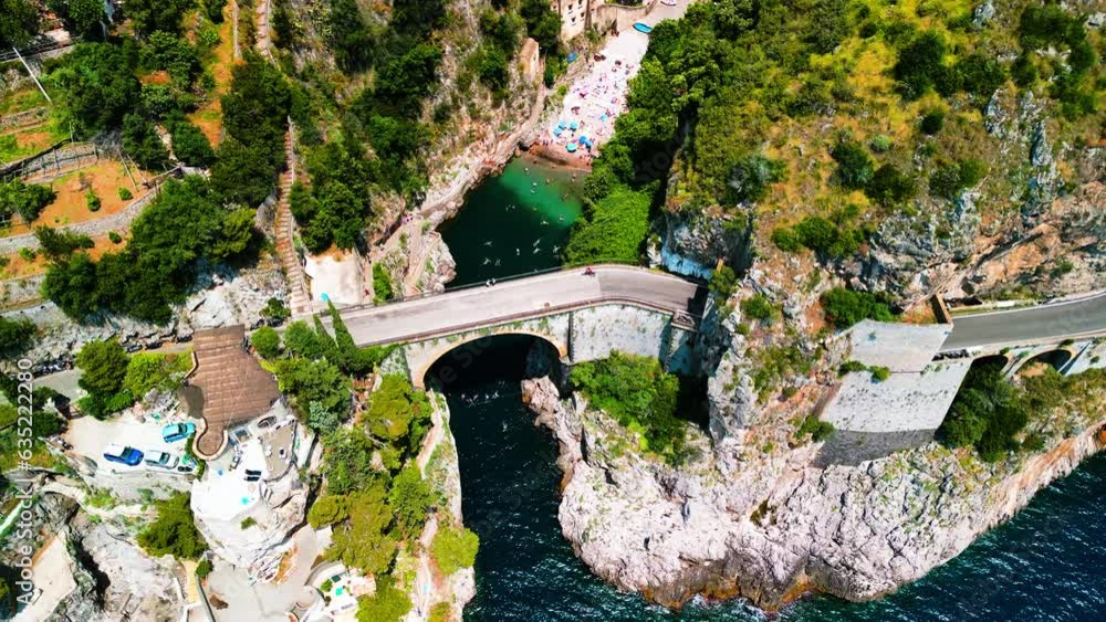 Upward aerial view of Fjord of Furore. Famous bridge and azure water at ...