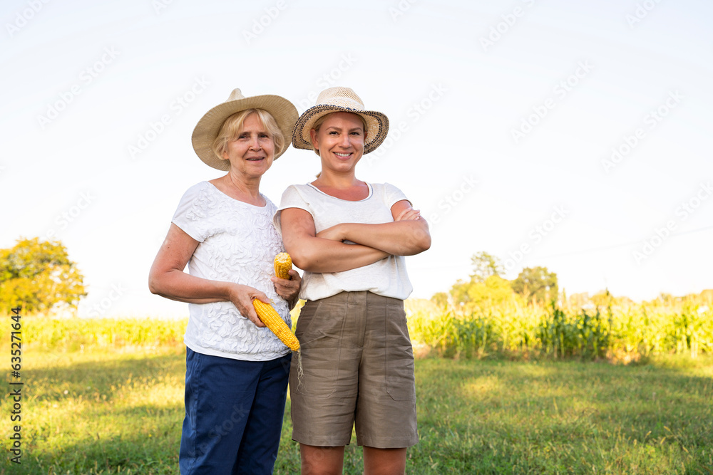 Poster Mother and daughter farmers standing proud on their property ...
