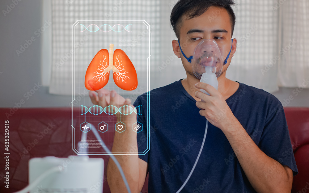 Asian boy wearing oxygen mask. man using asthma inhaler while sitting ...