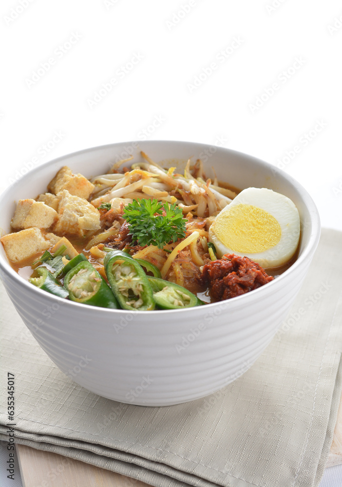 Malay mee rebus noodle with boiled egg, tofu, green chilli, sambal ...