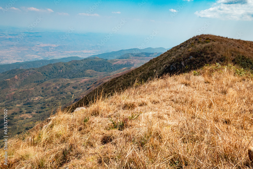 View of a valley against mountains seen from Mbeya Peak, Mbeya Mountain ...