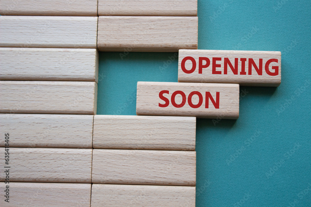 Opening soon symbol. Concept word Opening soon on wooden blocks ...