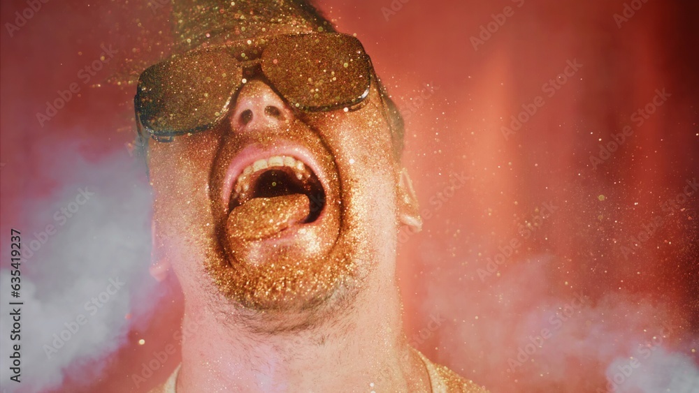 Crazy man sprinkles himself with sparkle particles. Fun video, funny ...