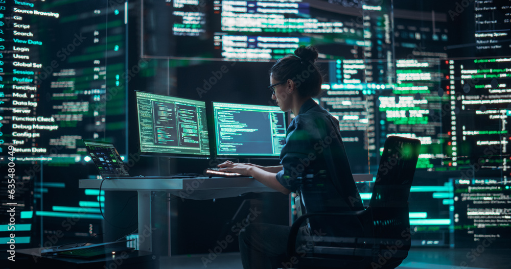 Female Developer Thinking and Typing on Computer, Surrounded by Big ... Female Developer Thinking and Typing on Computer, Surrounded by Big ...