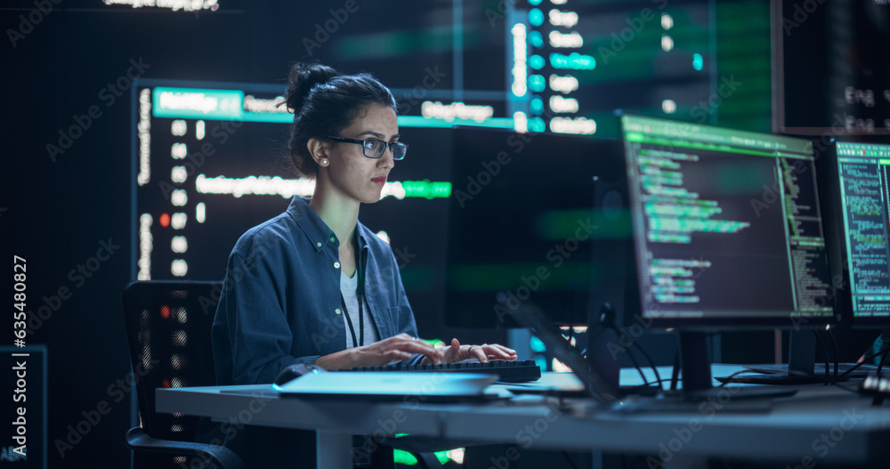 Female Programmer Working in Monitoring Control Room, Surrounded by Big ...