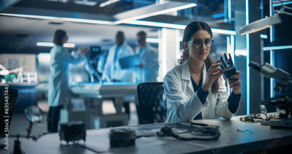 Talented Young Female Scientist Working on a Prosthetic Robotic Hand ...