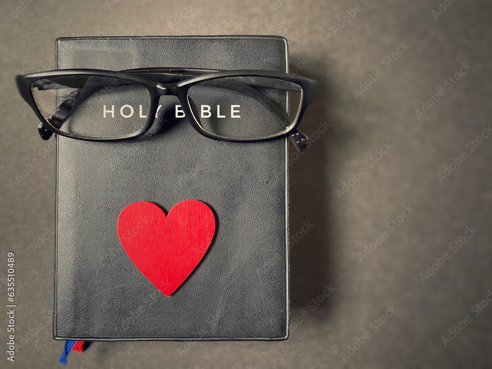 Red heart and glasses Holy Bible. Bible reading, discerning God words ...
