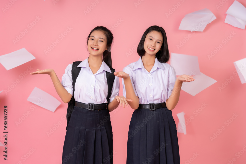 Two young Asian female students with short hair and long hair. wearing ...