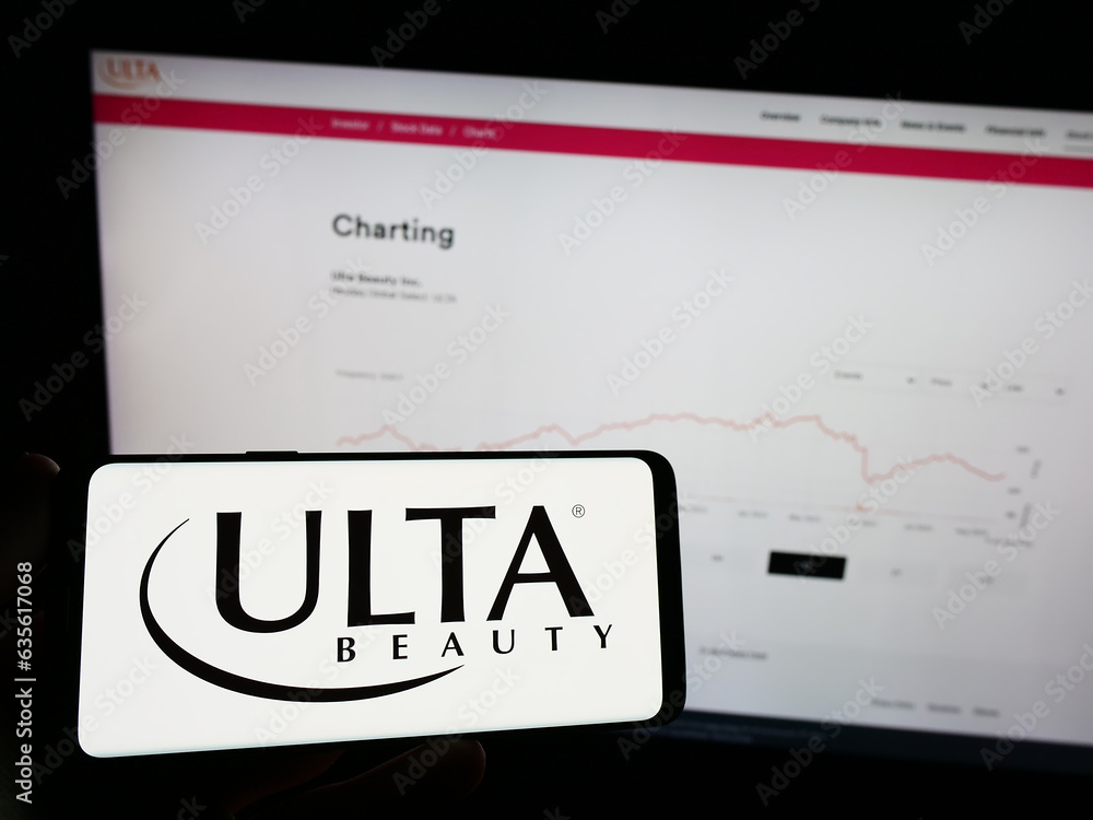 Stuttgart, Germany - 08-11-2023: Person holding mobile phone with logo ...