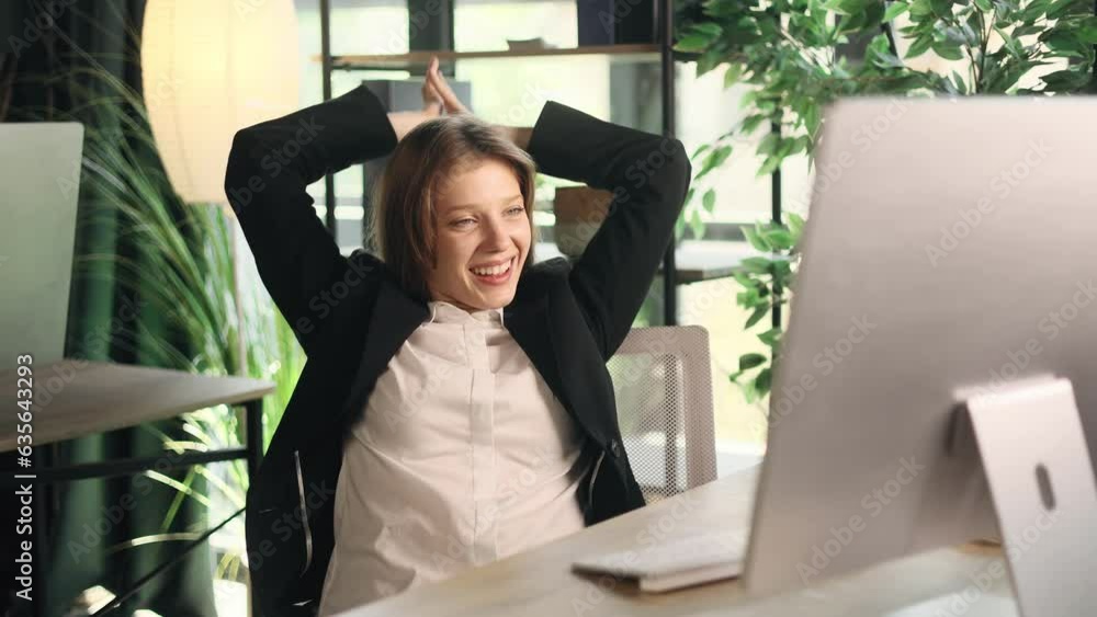 Positive tired young businesswoman feels satisfied with work well done ...