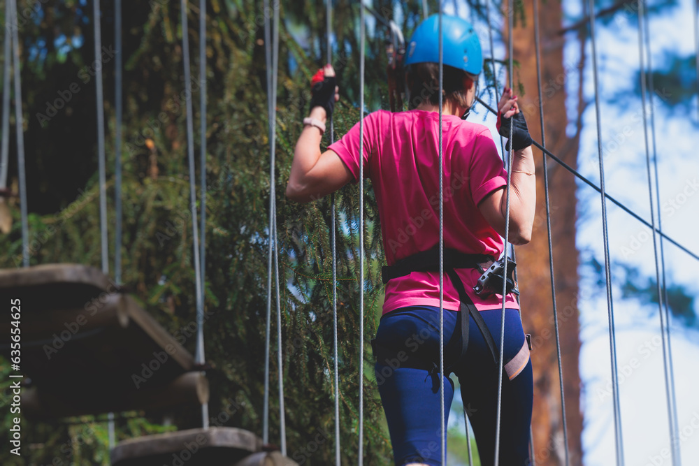 View of high ropes course, process of climbing in amusement acitivity ...