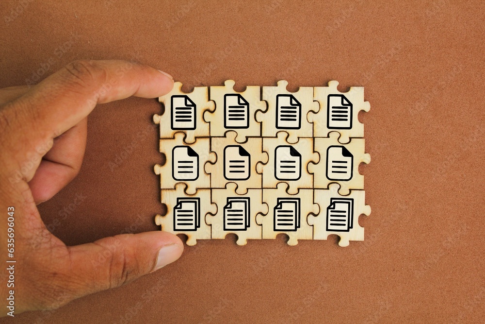 wooden puzzle with stacked file icons. Concept document management ...