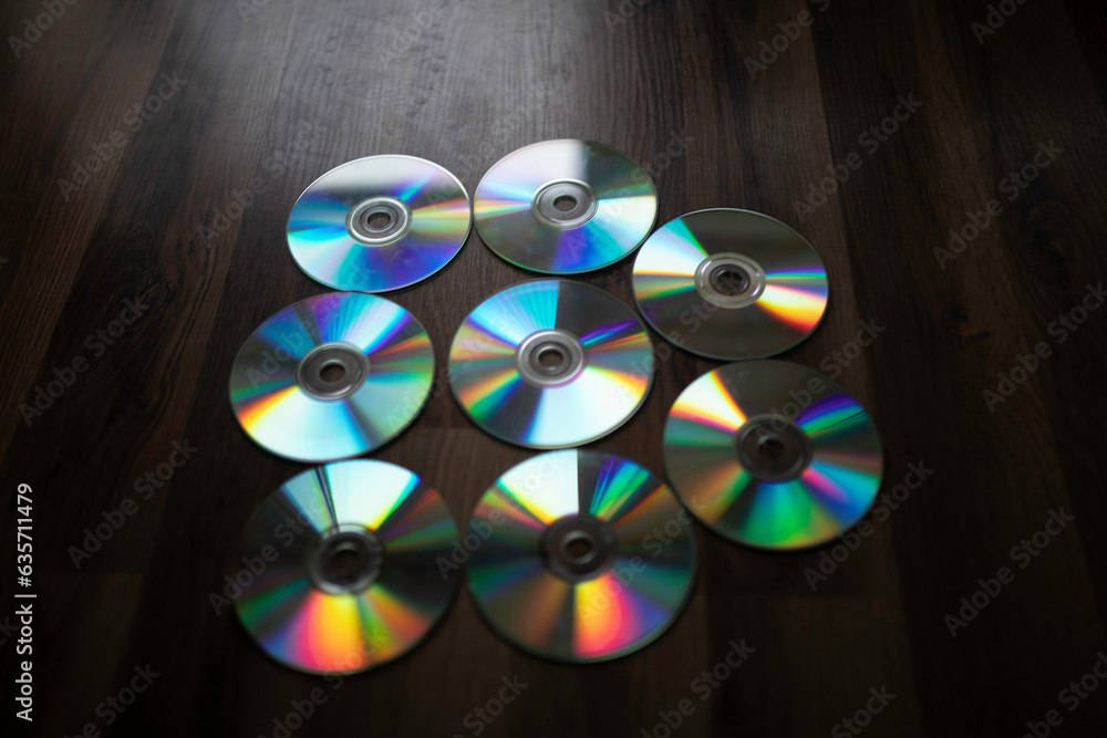 cd plates splitting light, diffraction. group of plates on the floor ...
